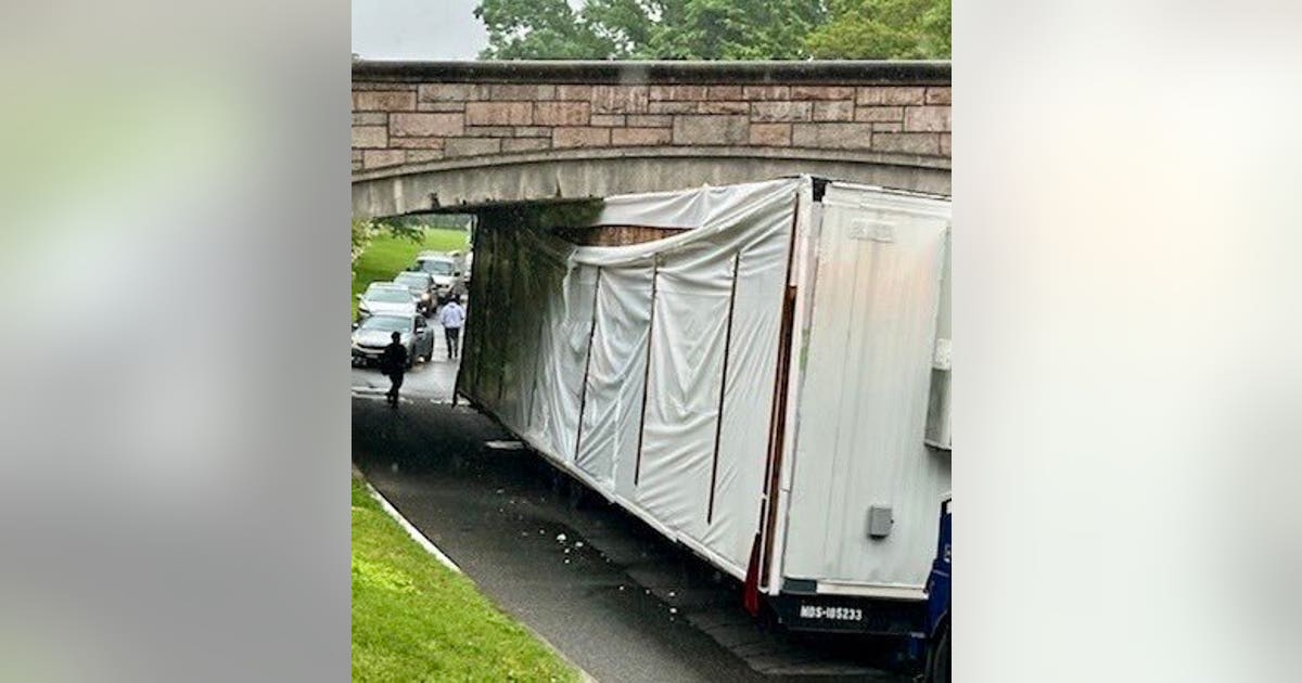 Tractor-trailer struck bridge in DC, wedged underneath: police | FOX 5 DC