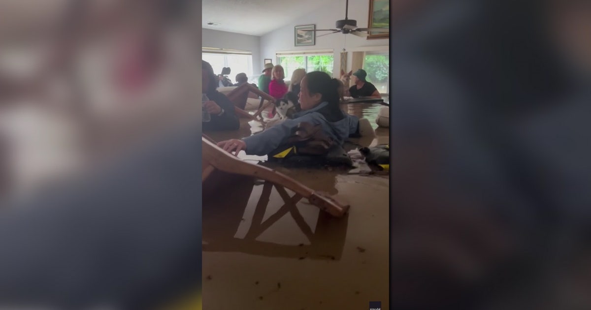 Helene’s fast rising flood surge leaves neighbors standing in chest ...