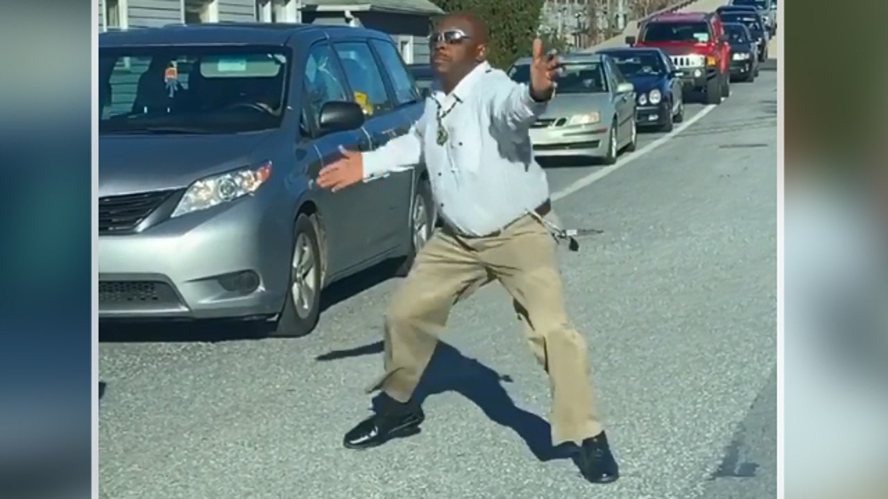 Video: Driver stuck in Baltimore traffic jam gets out, dances in street ...