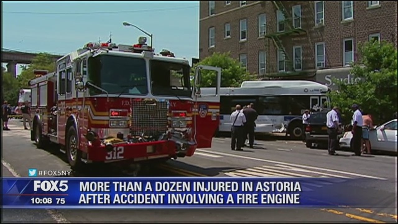 14 hurt, including 2 firefighters, in fire truck collision