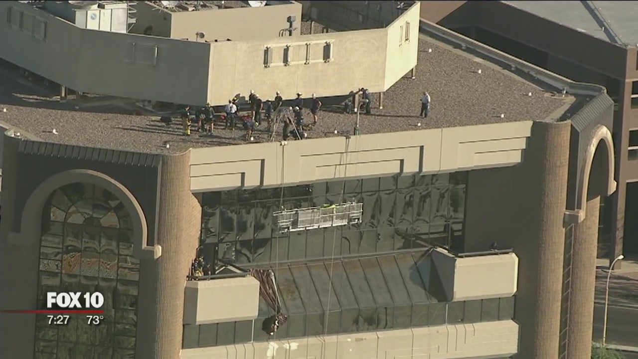 Firefighters rescue painters stuck outside Phoenix high-rise building