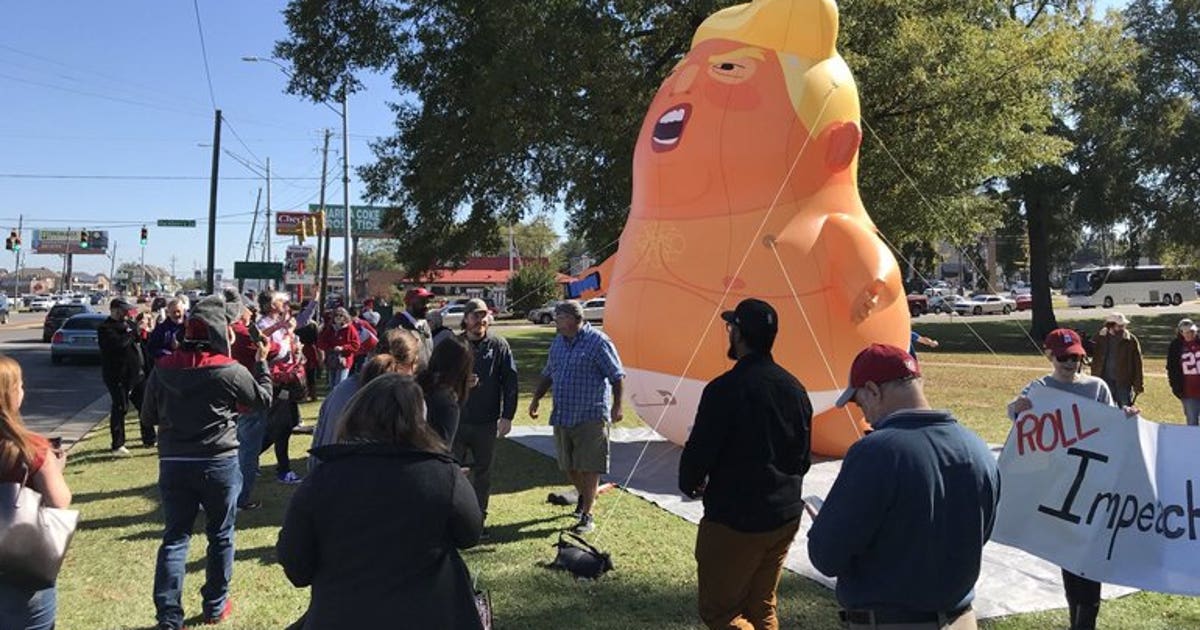 Towering 'Baby Trump' protest balloon slashed, deflated at Alabama ...
