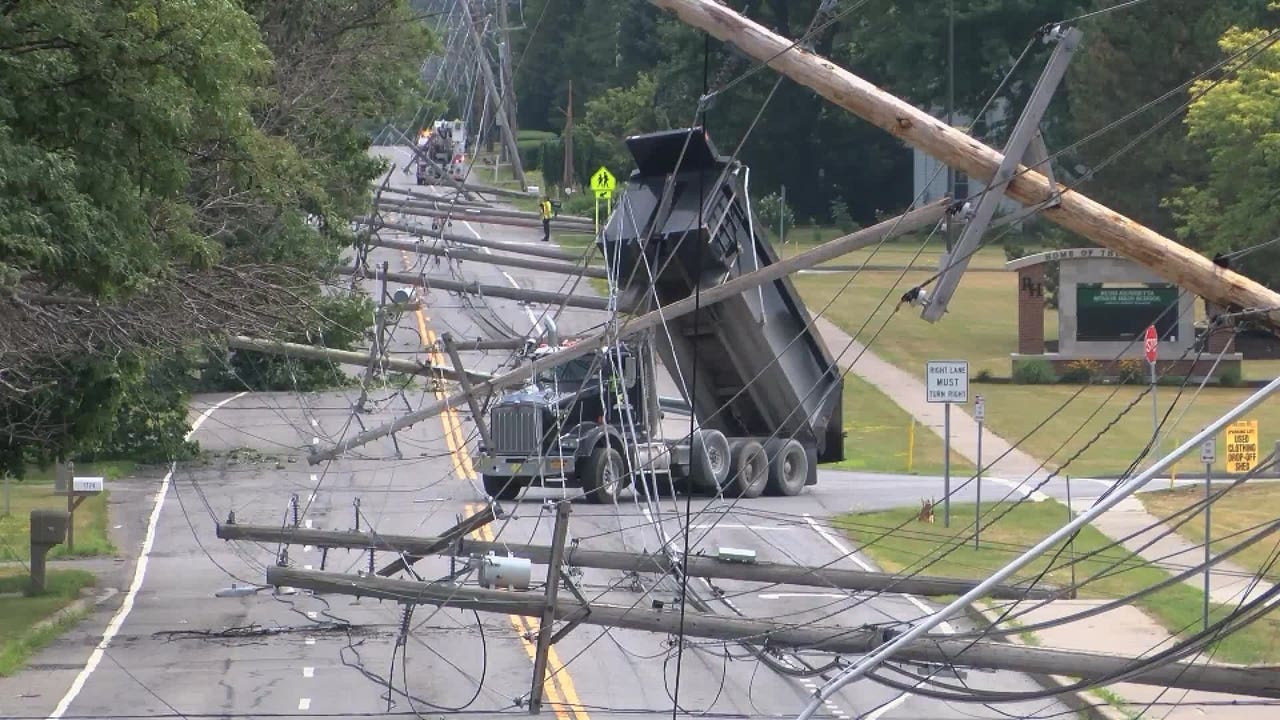 Driver topples utility poles with upright dump truck | FOX6 Milwaukee