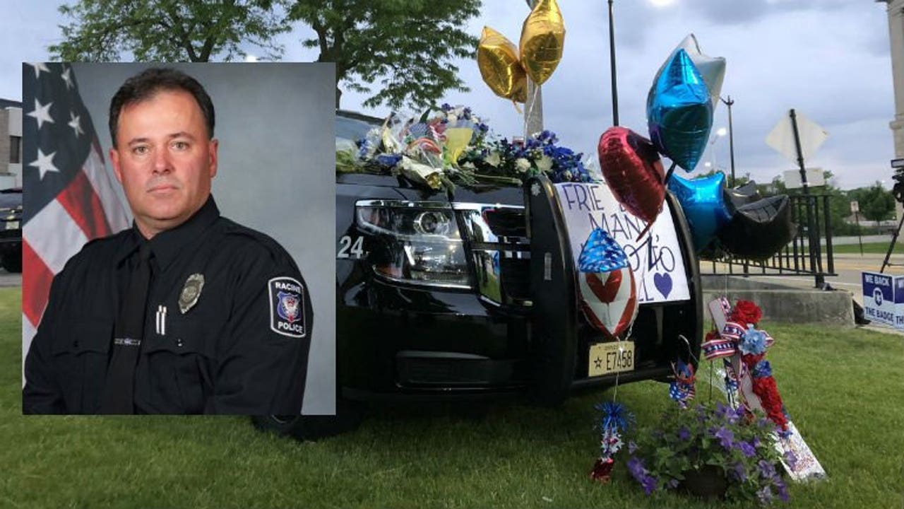 Memorial Grows Outside Racine Police Department For Officer John Hetland