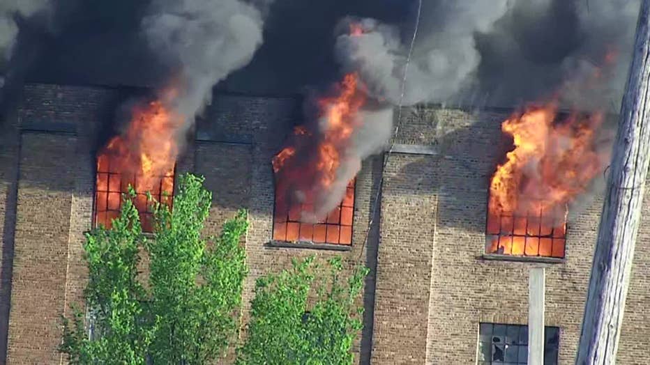 Milwaukee fire: Woman charged, vacant warehouse destroyed | FOX6 Milwaukee