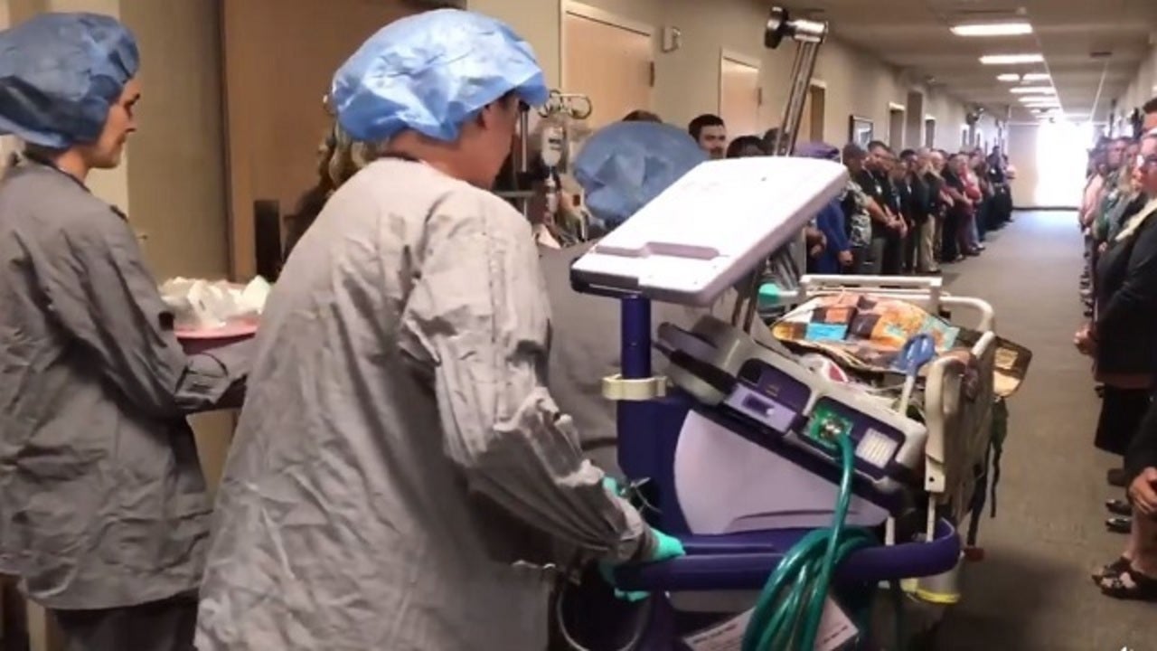 Hospital staff lines up to show respect to organ donor