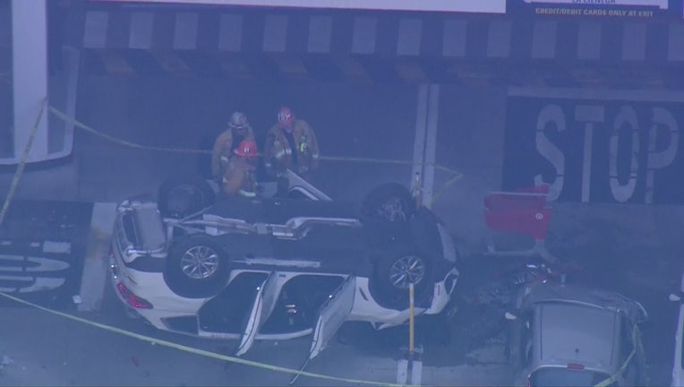 Vehicle falls out of parking garage at Beverly Connection Center, minor ...