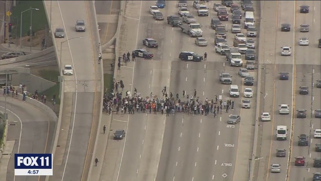Group of protesters block 405 Freeway in West LA