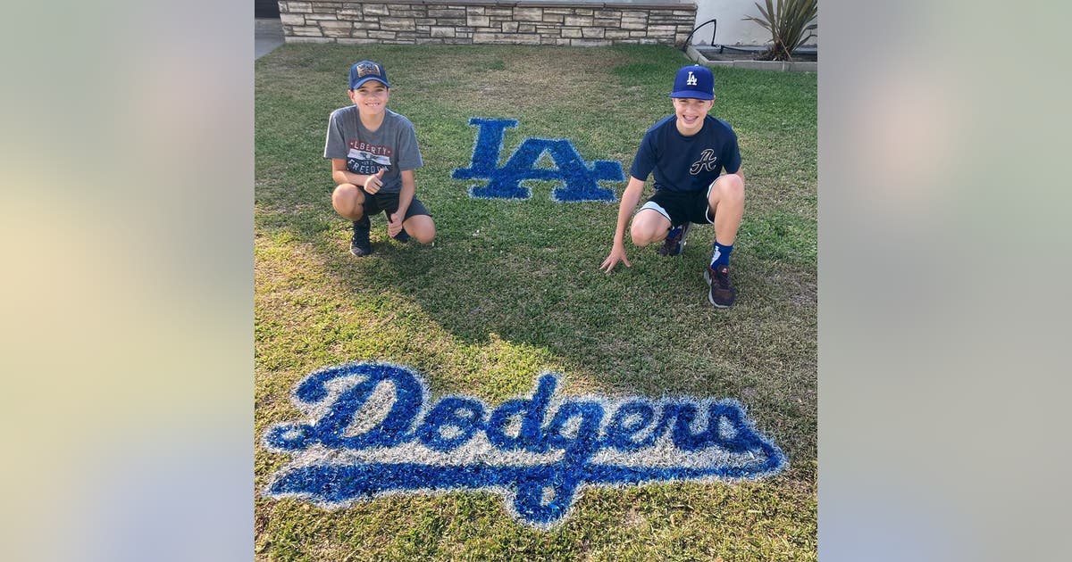 Brothers show their Dodgers spirit spray painting team logos on lawns ...