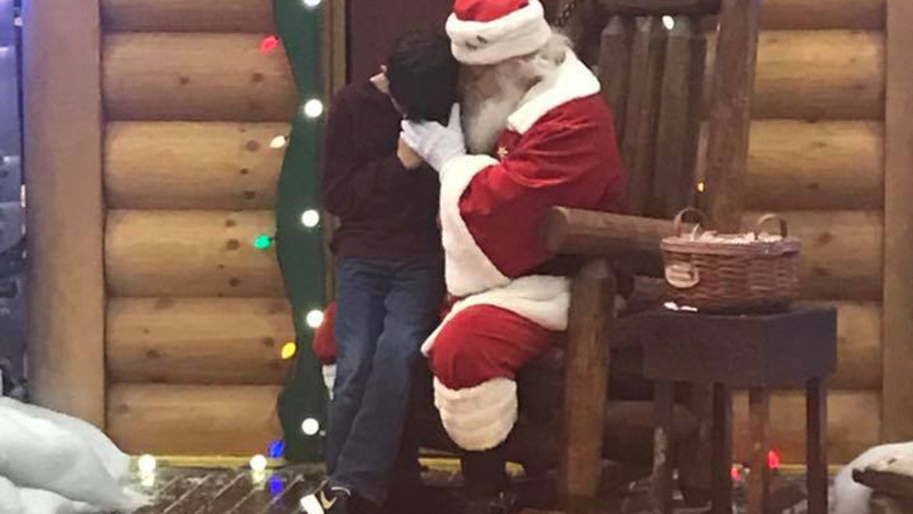 Photo captures moment boy asks Santa to help his sick father