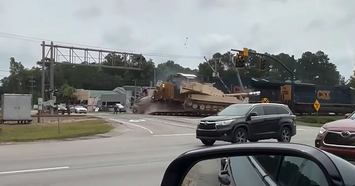 Watch: Train slams into semi carrying military tank | LiveNOW from FOX