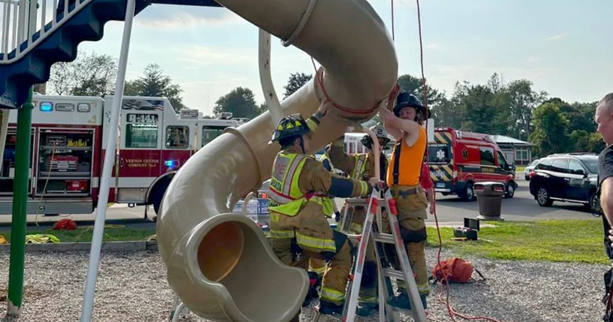 Firefighters cut open playground slide to rescue 40-year-old man stuck ...