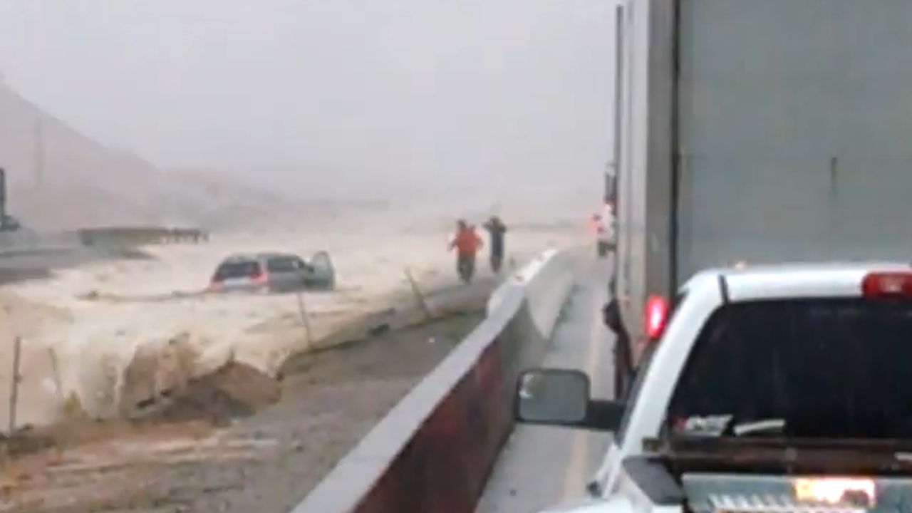 Harrowing flood video: Rushing water sweeps man under van, into ravine ...