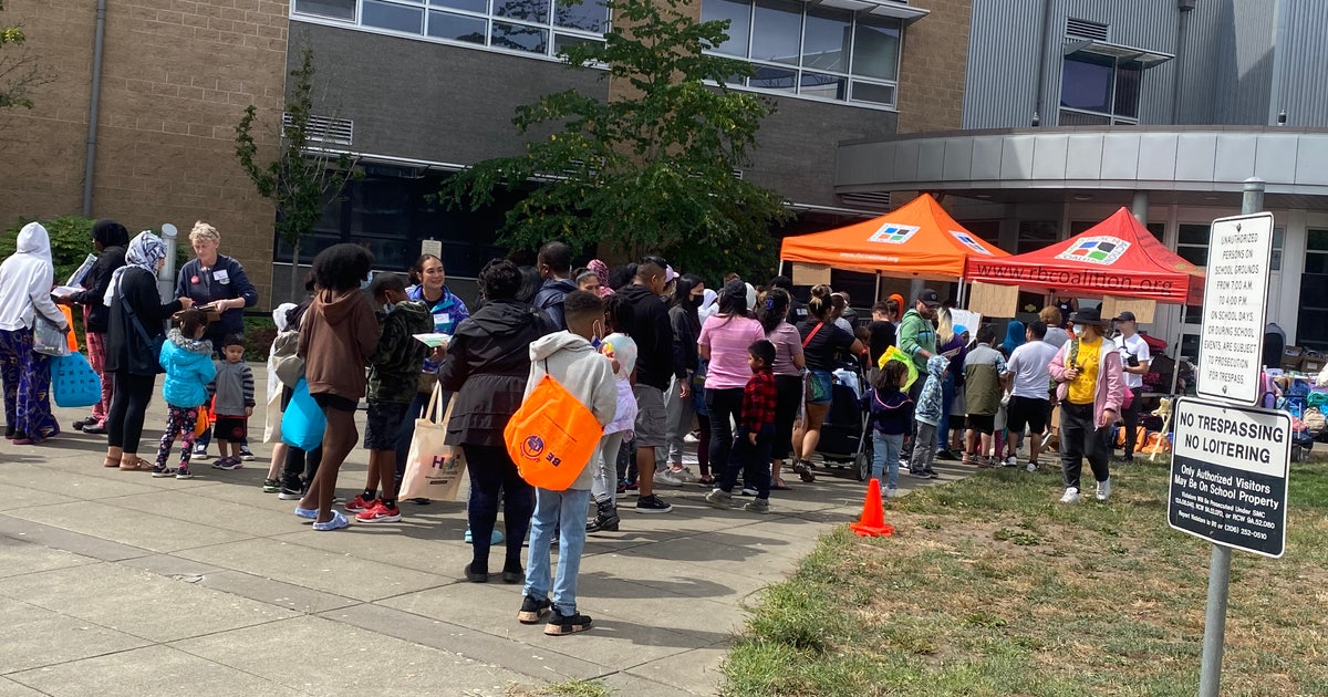 Students form long lines for 'Back2School Bash' backpack giveaway | FOX ...