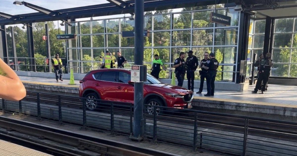 Car drives onto light rail tracks, disrupting service | FOX 13 Seattle